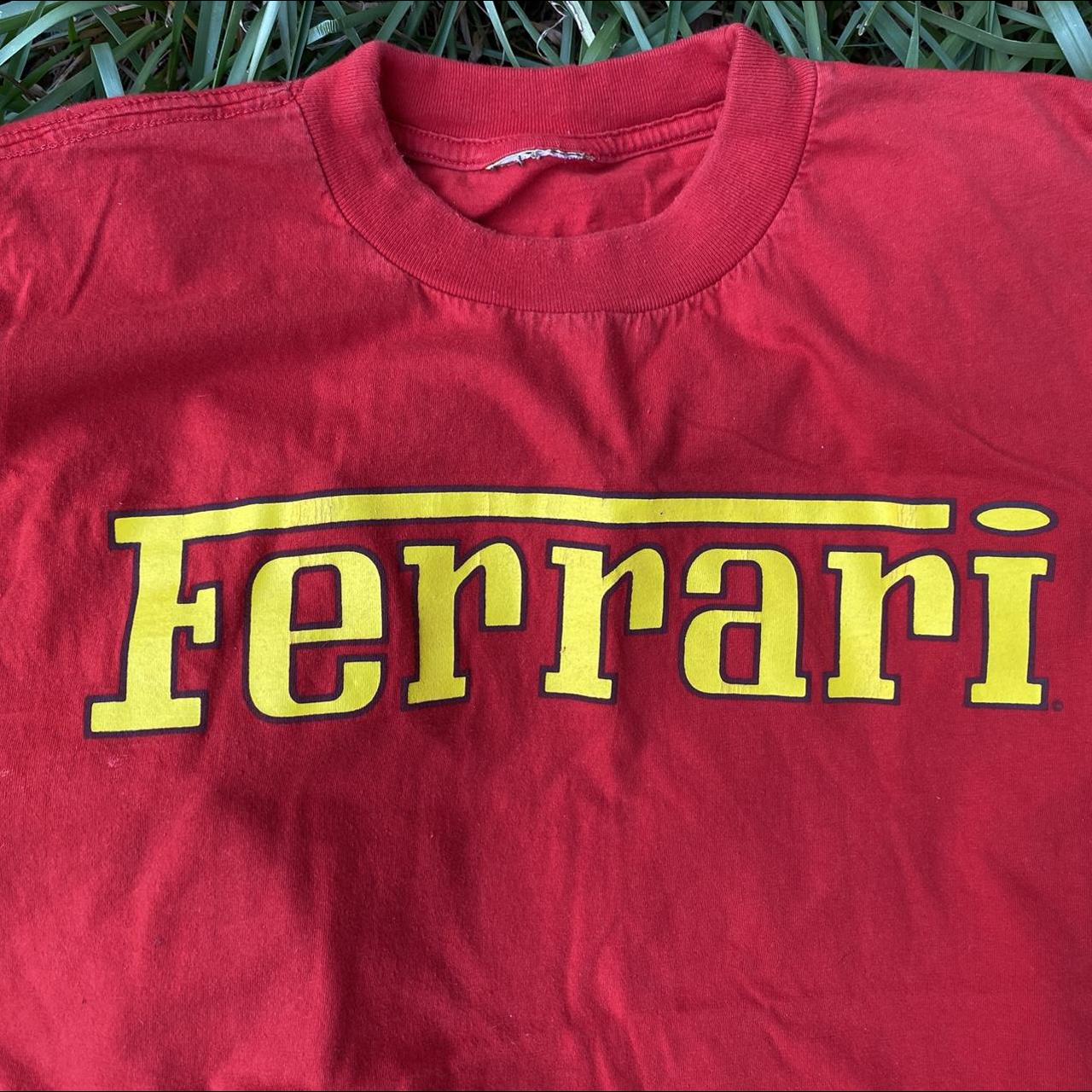 - Red with Ferrari name in yellow printed on the... - Depop