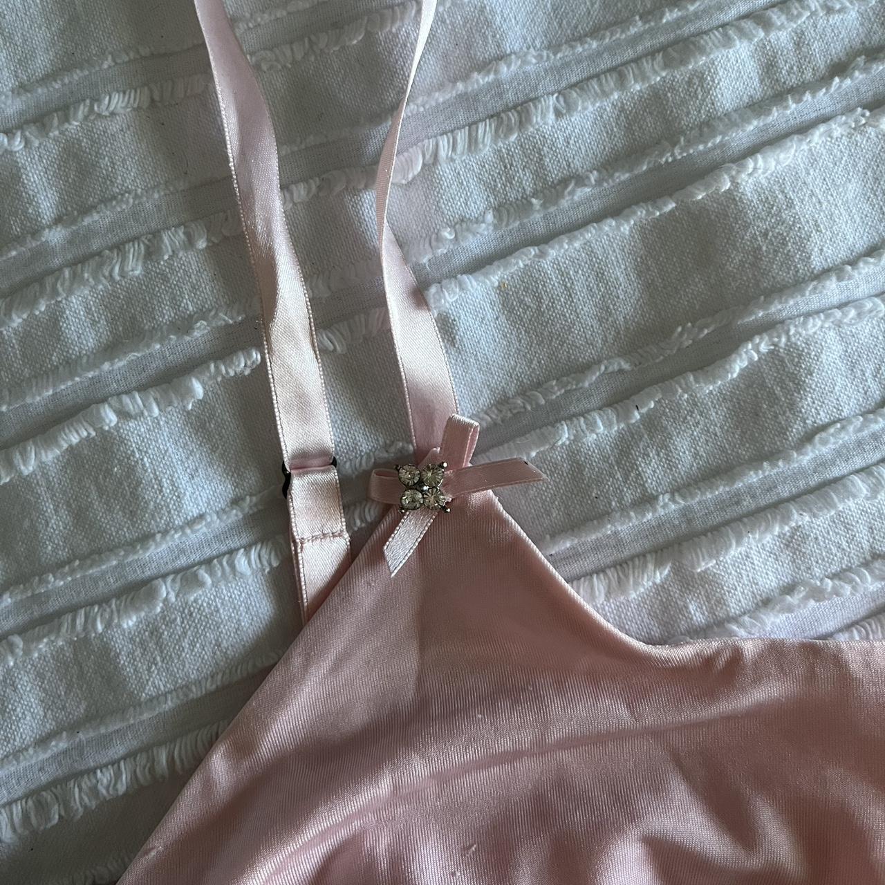 Baby pink cami top with bows on straps Has two holes... | Depop