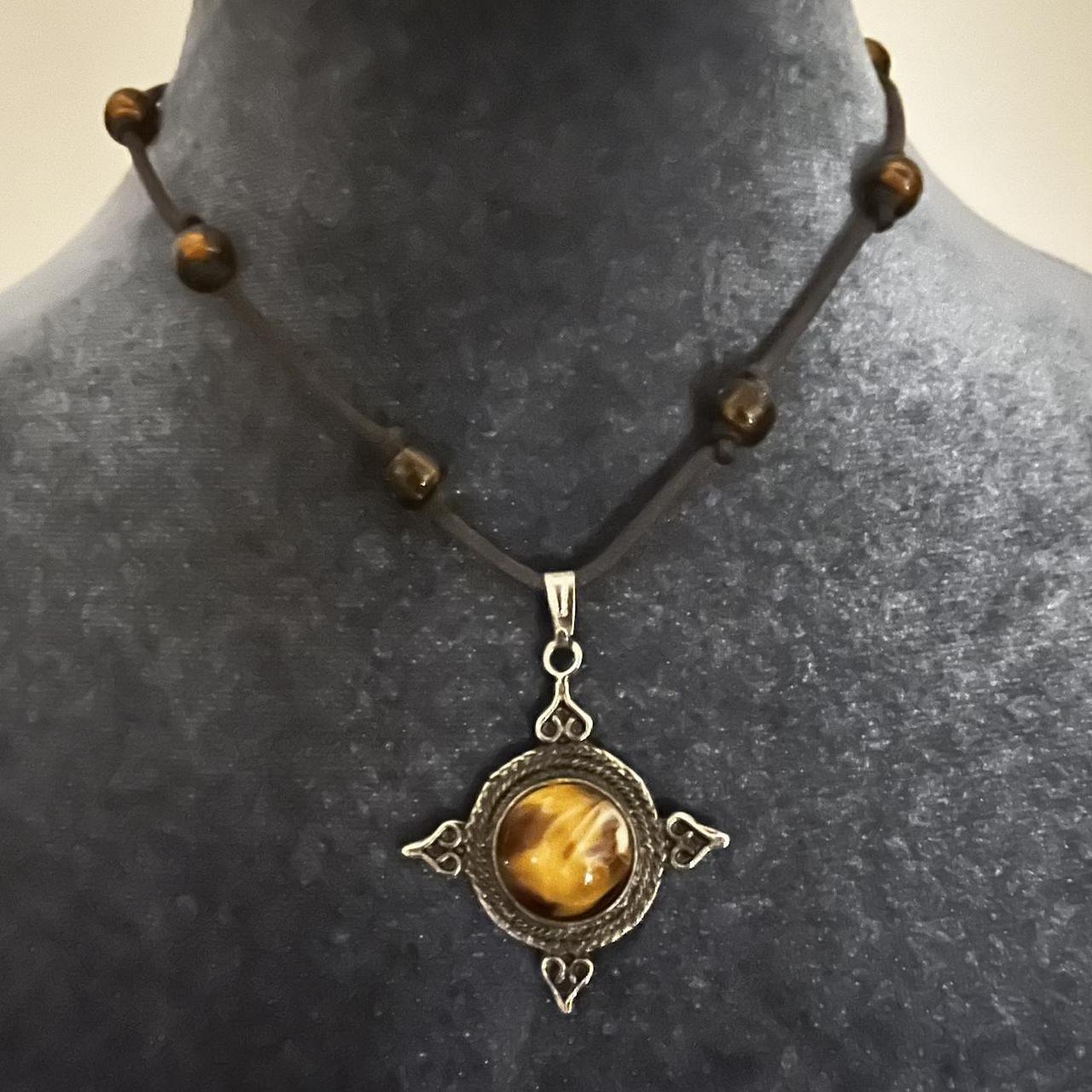 Like new brown corded necklace with amber colored... | Depop