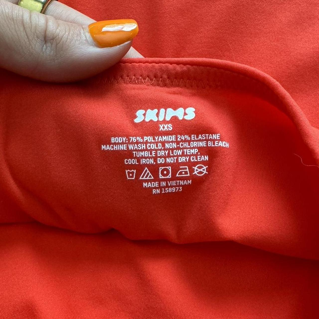 SKIMS poppy colored bodycon strapless dress. Size... - Depop