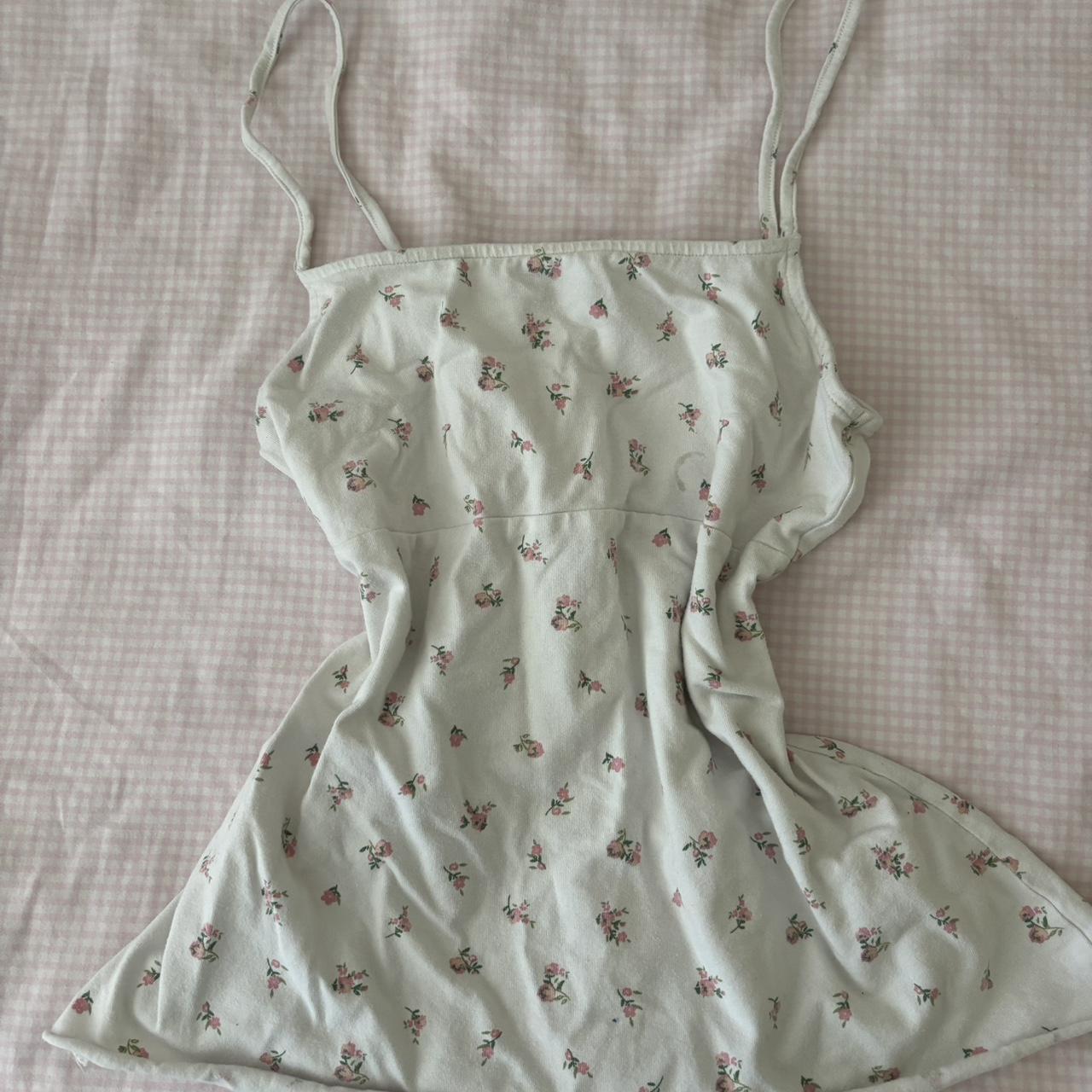 Cute white floral tank with adjustable straps... | Depop