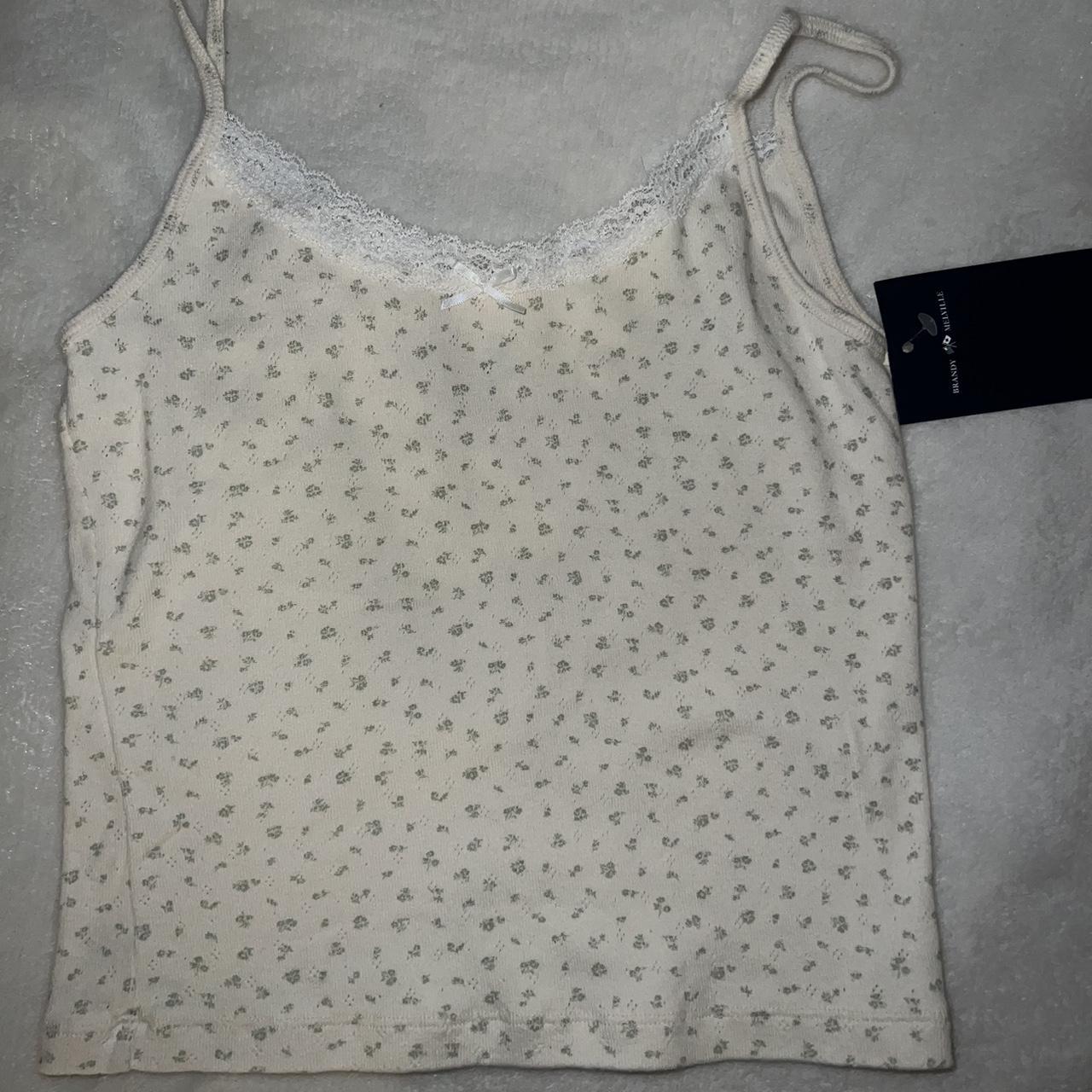 Brandy Melville cream colored tank with green... - Depop