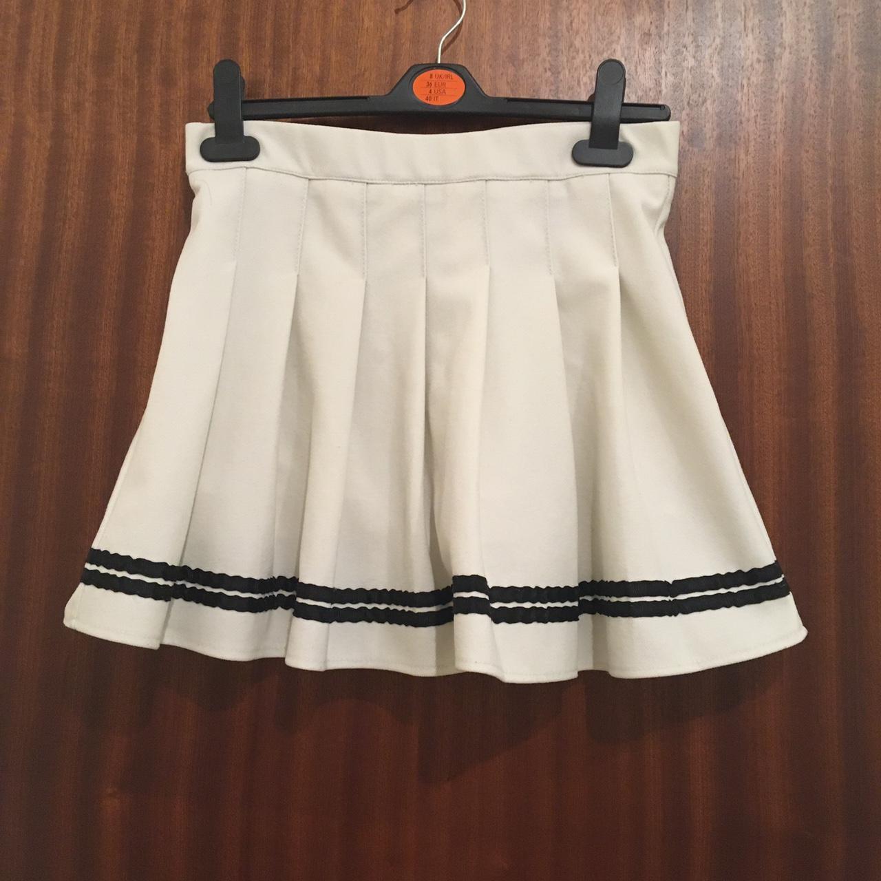 White skirt with black stripes. Fits like a size 6.... - Depop