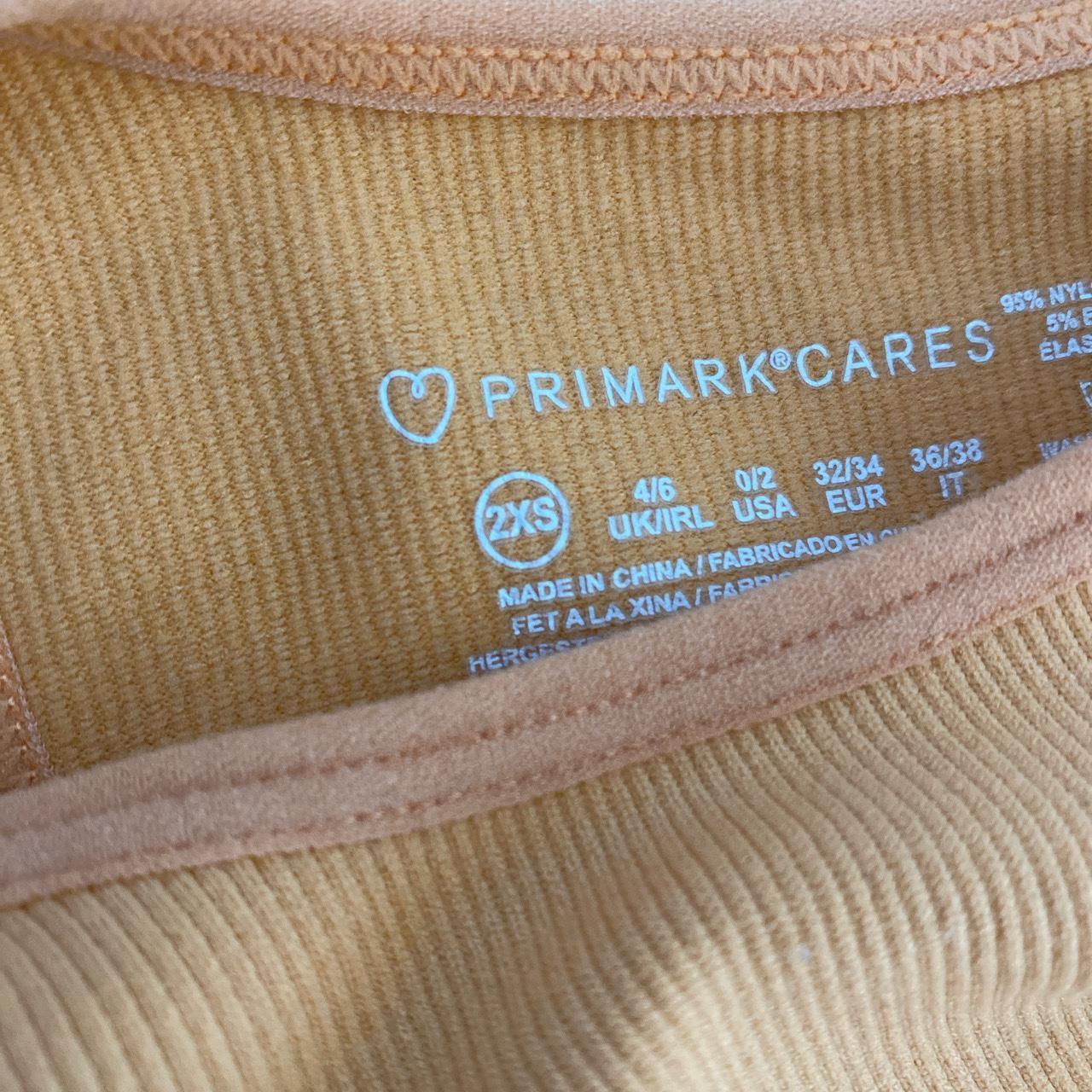 orange gym shorts and vest top set from primark gym... - Depop