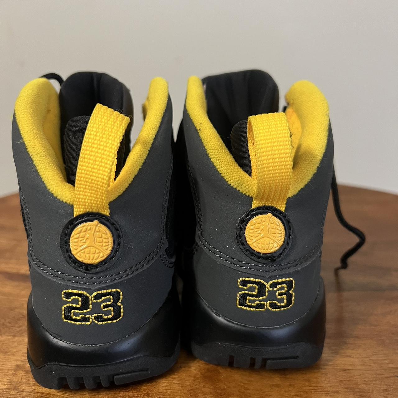 The Air Jordan 9 Retro Dark Charcoal University Gold... - Depop