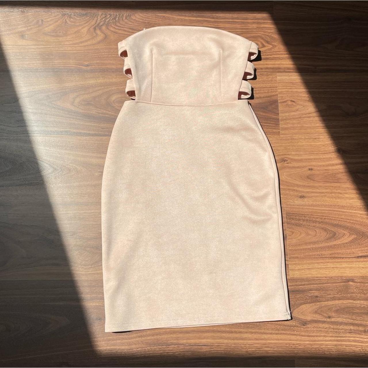 Light pink bodycon dress with cut out panels on the... - Depop