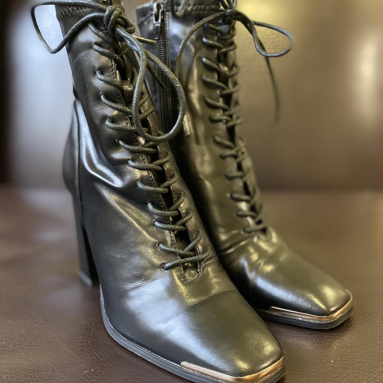 The coolest lace up black boot heels with gold rim... - Depop