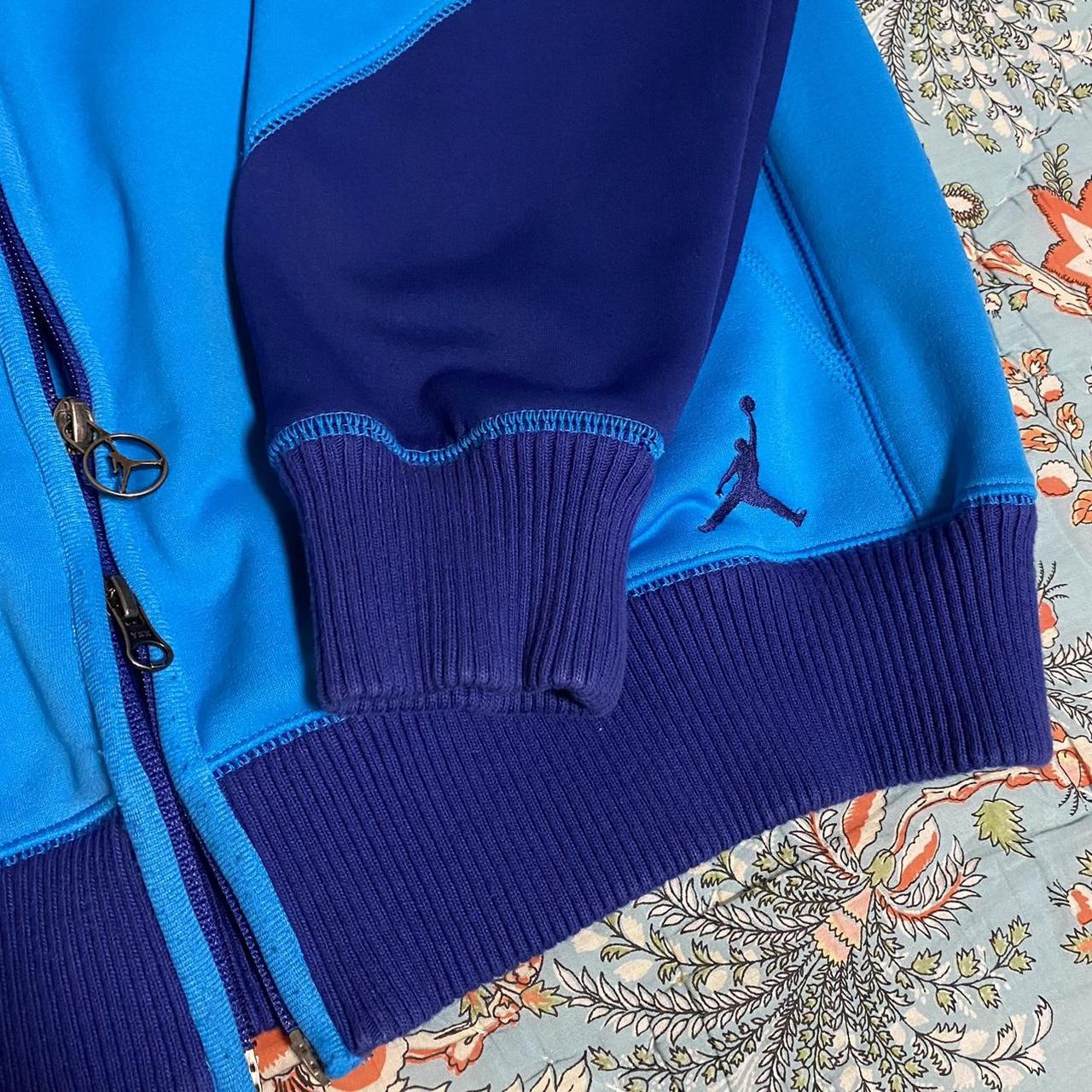 Jordan light blue and dark blue color blocked jacket... - Depop