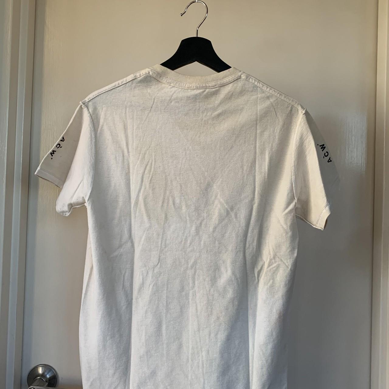 ACW beige shirt Few pictured flaws, with some wash... - Depop