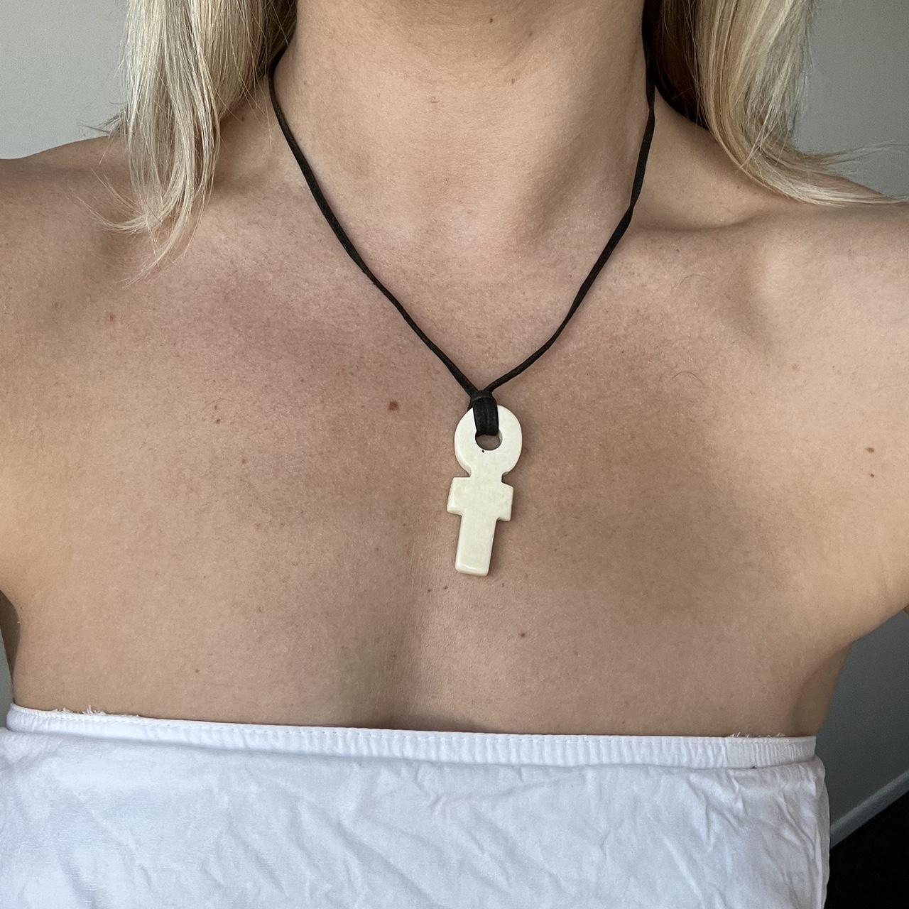 Y2k pendant necklace. Just ties up to fasten, so you... - Depop