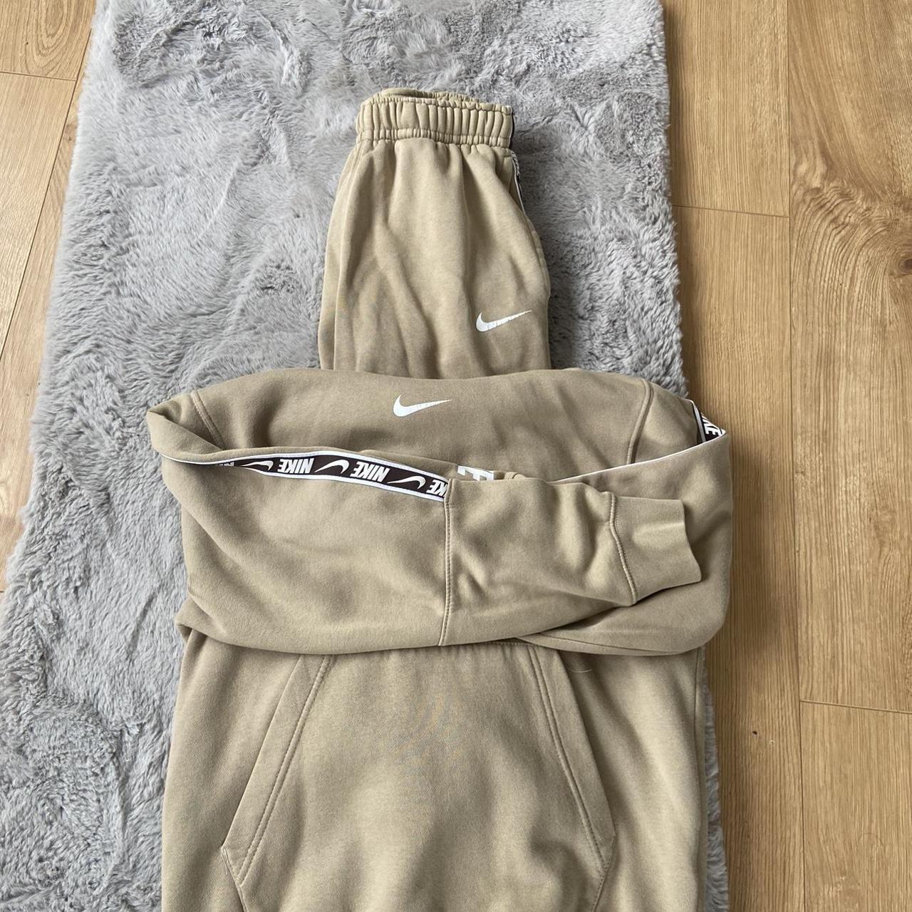 Cream Nike taper tracksuit Slight cracking in... - Depop
