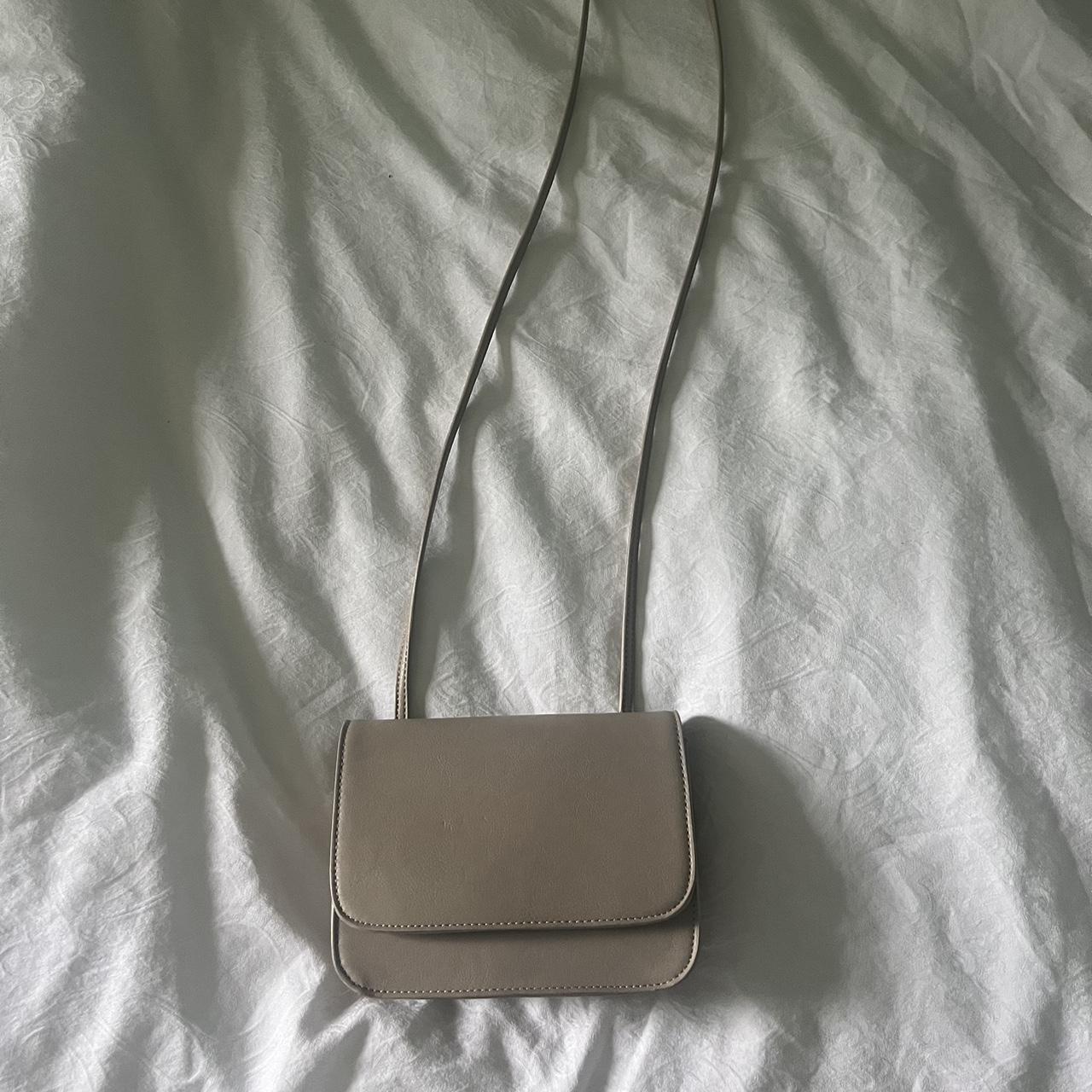 Medium/small tan purse! Long cross body strap. Worn... - Depop