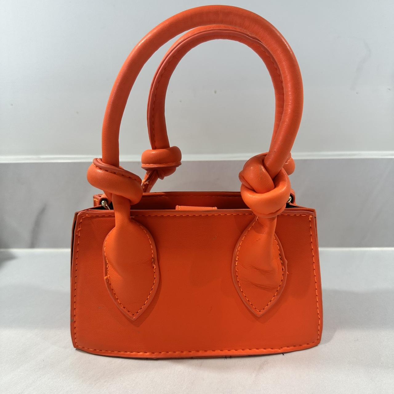 Orange mini bag with gold strap. Only ever used... | Depop