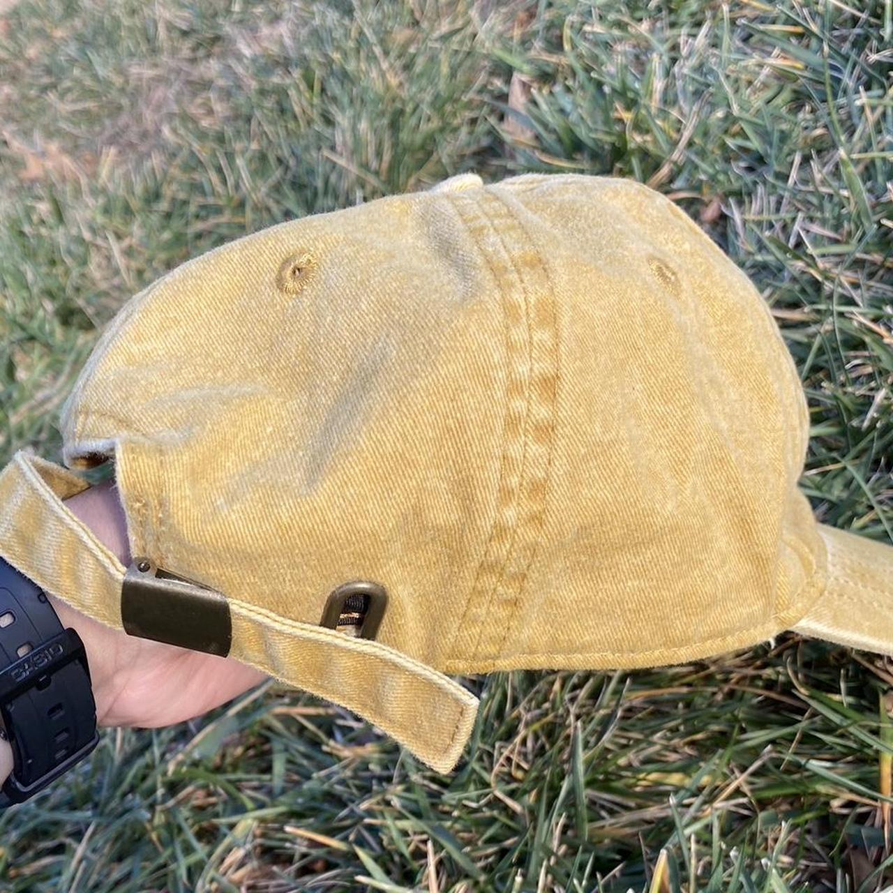 unisex faded yellow hat with metal back size:... - Depop