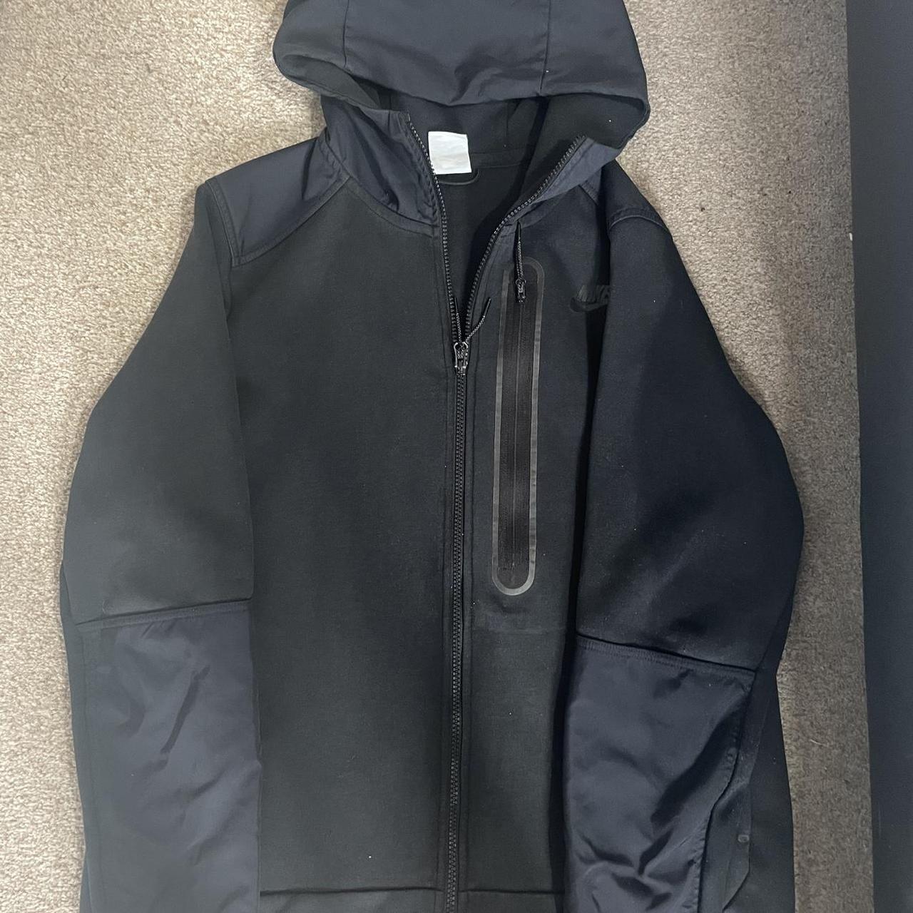 Black and navy Nike woven tech fleece size large... | Depop