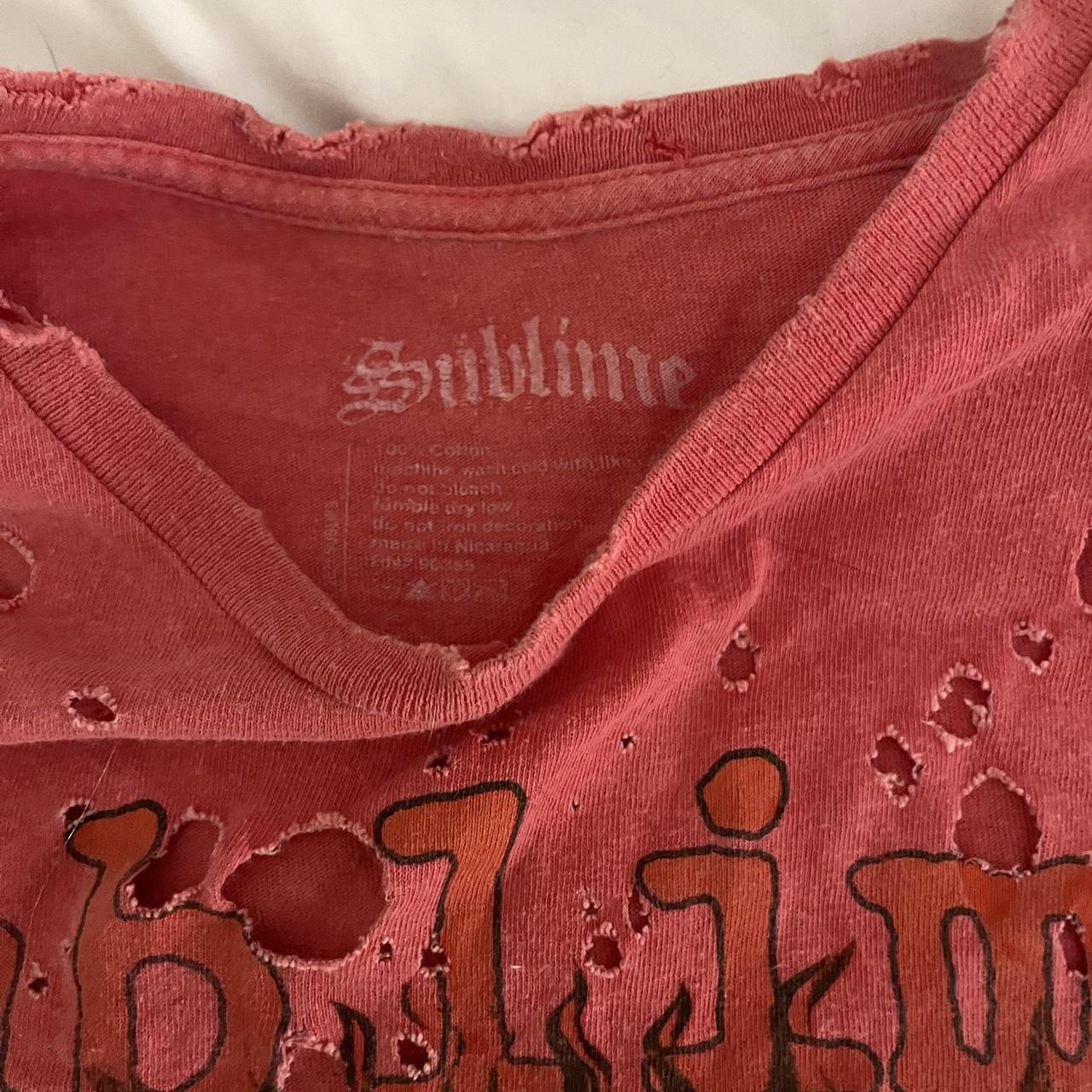pink sublime ripped t-shirt size fits as XL - Depop
