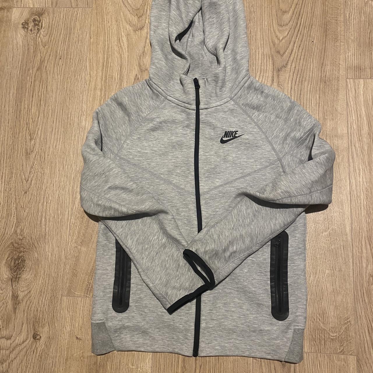 Grey Nike Tech Fleece hoodie with minor marks on the... - Depop