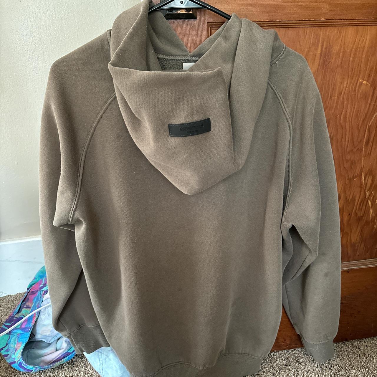 olive green Essentials hoodie, a couple of small... - Depop