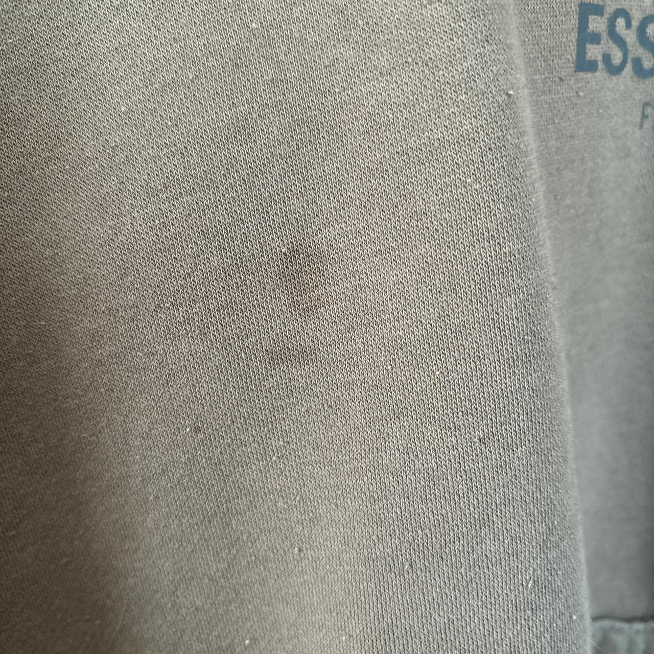 olive green Essentials hoodie, a couple of small... - Depop