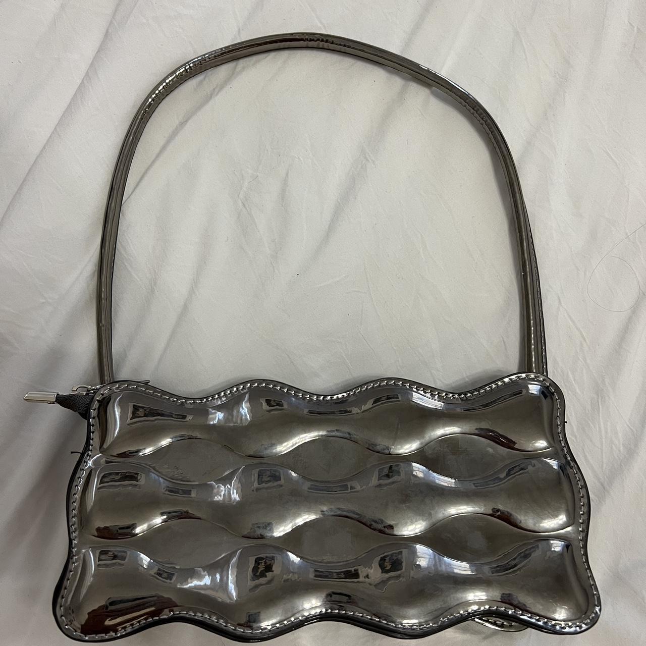Small silver purse with hand strap detail and... - Depop