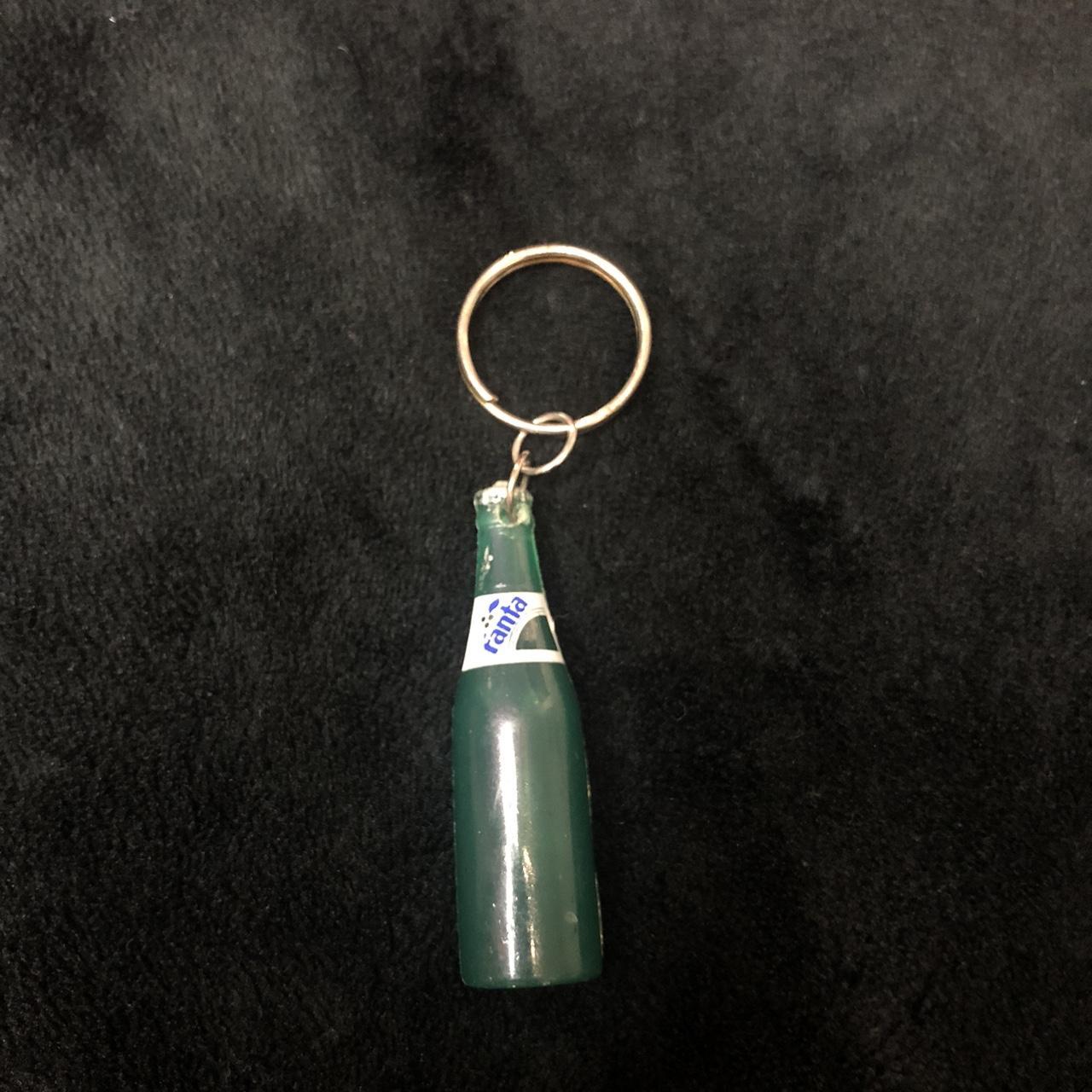 Original Fanta bottle green keyring from the year... - Depop