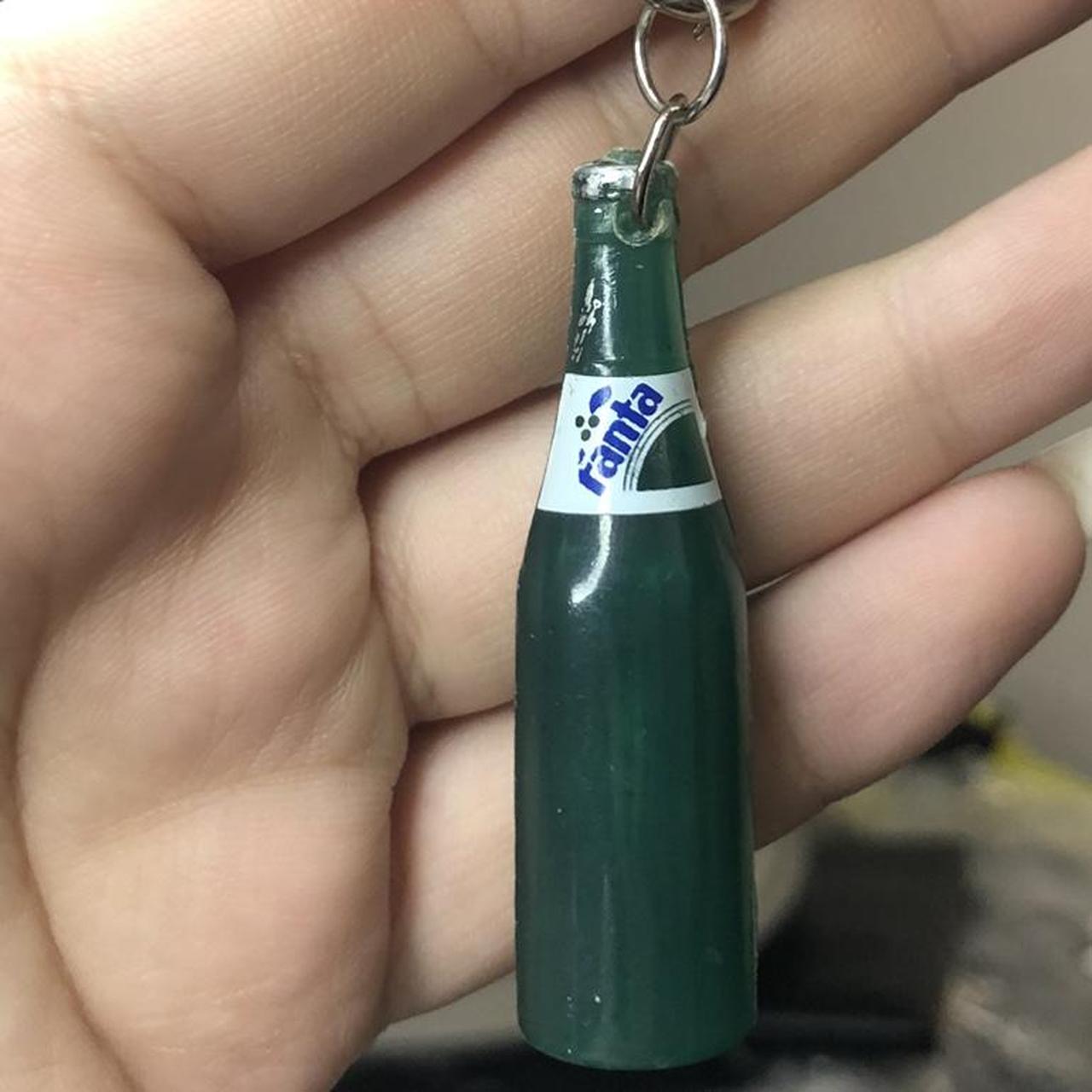 Original Fanta bottle green keyring from the year... - Depop
