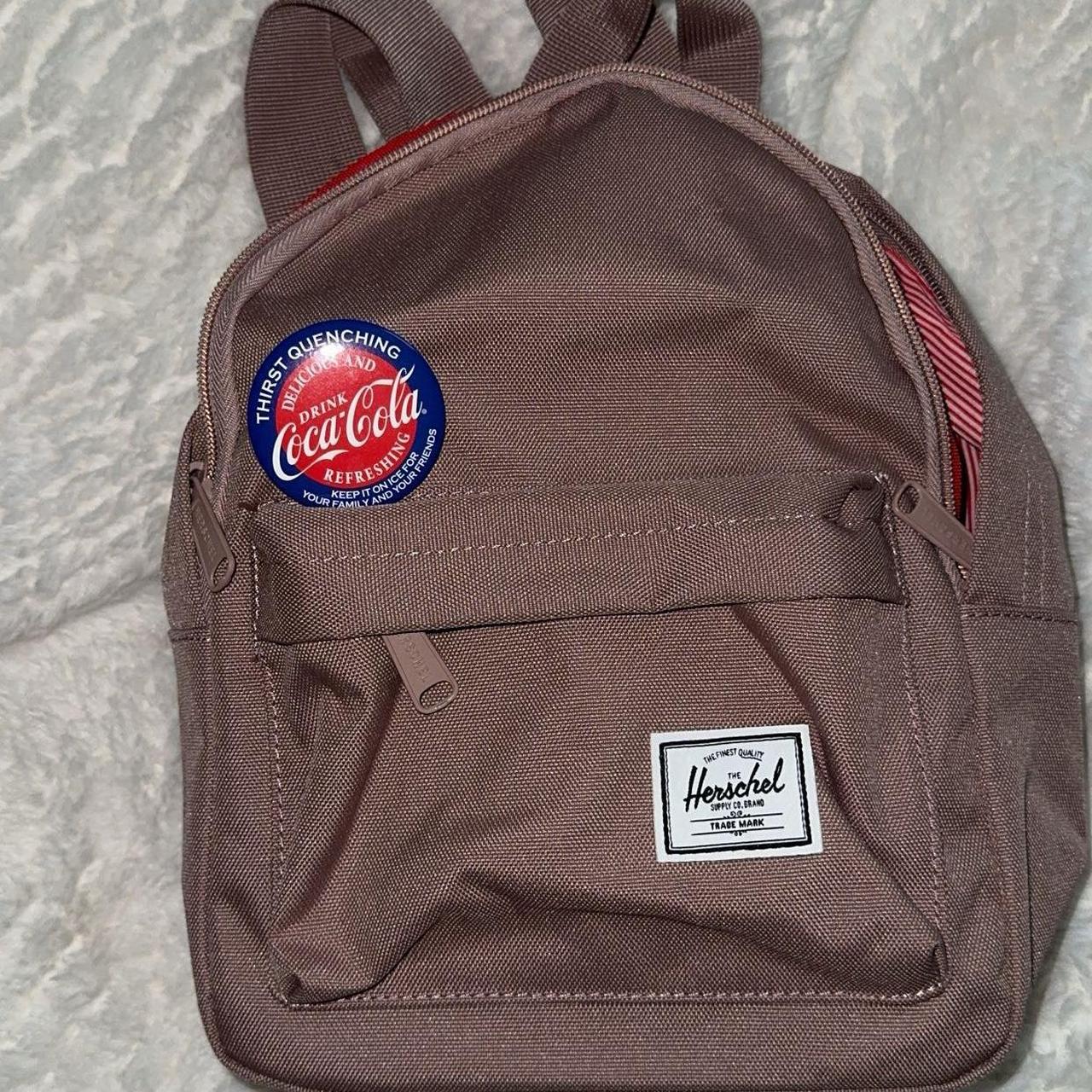 Mini mauve/brown Herschel backpack with red and... - Depop