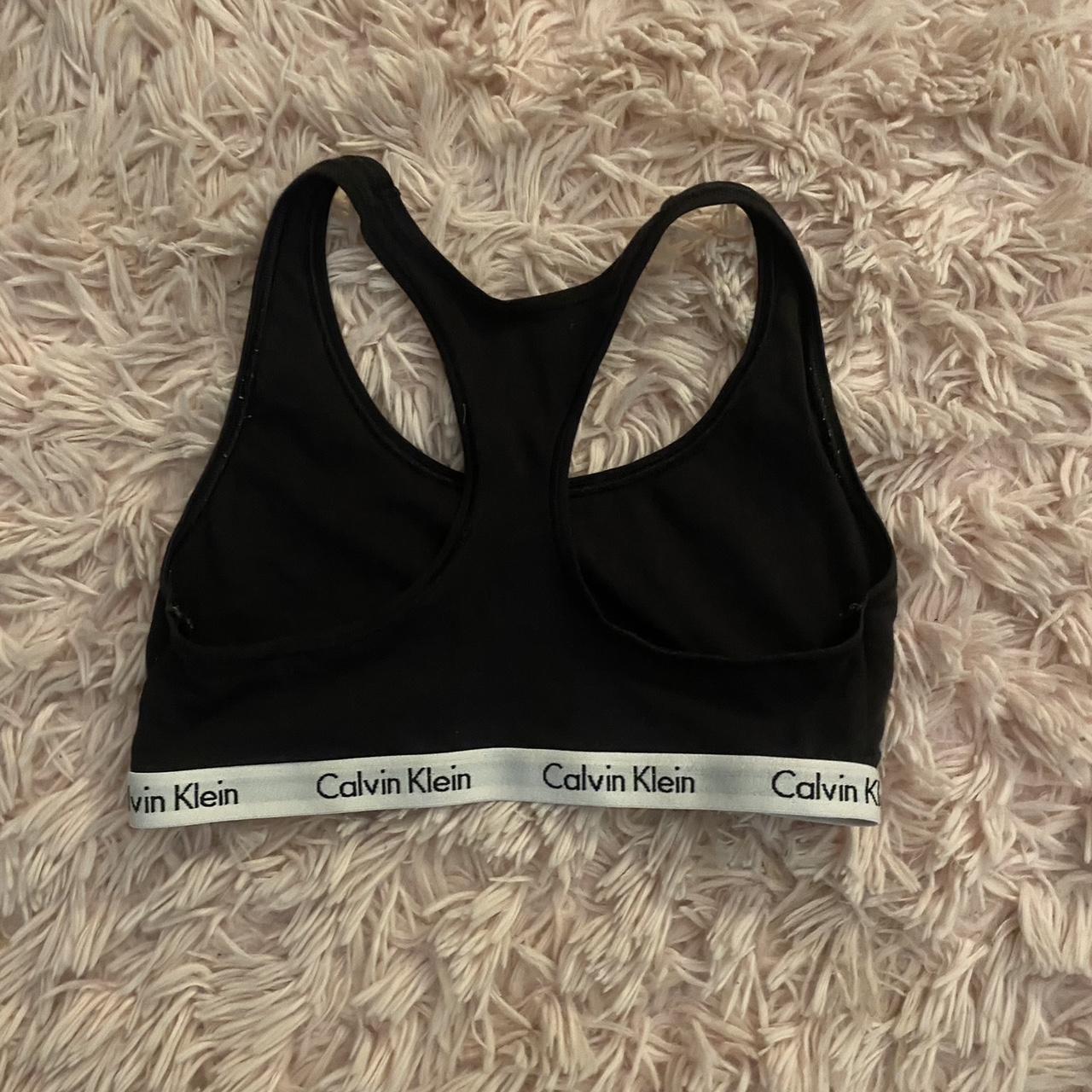 Calvin Klein black sports bra Labeled as small but... - Depop