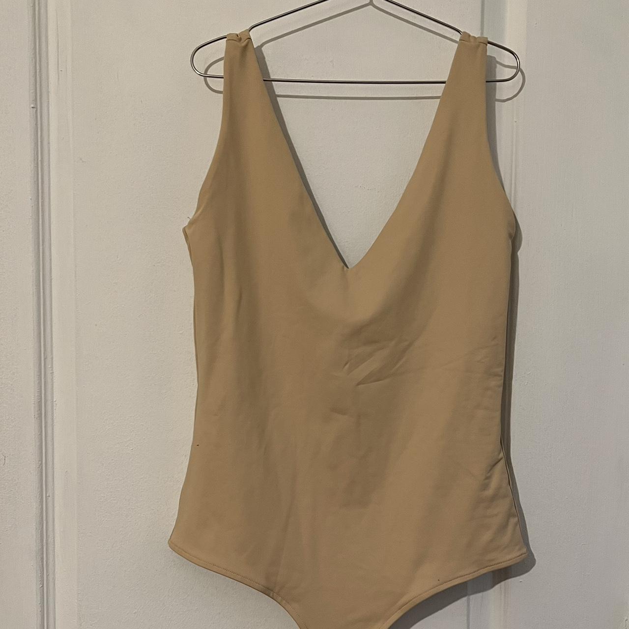 Tan bodysuit, never worn, size M! Brand tagged for... - Depop