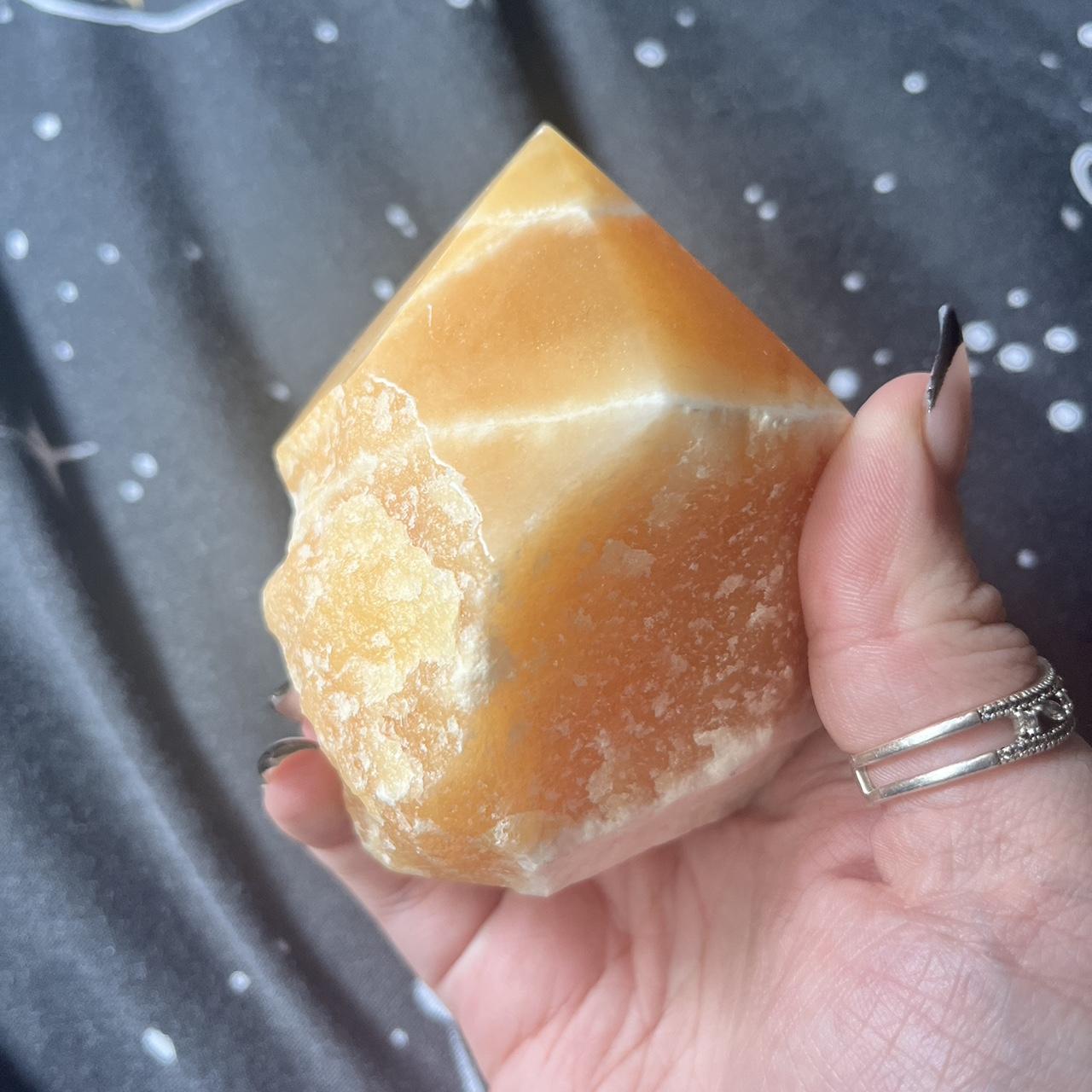 ORANGE CALCITE POINT half raw, half... - Depop