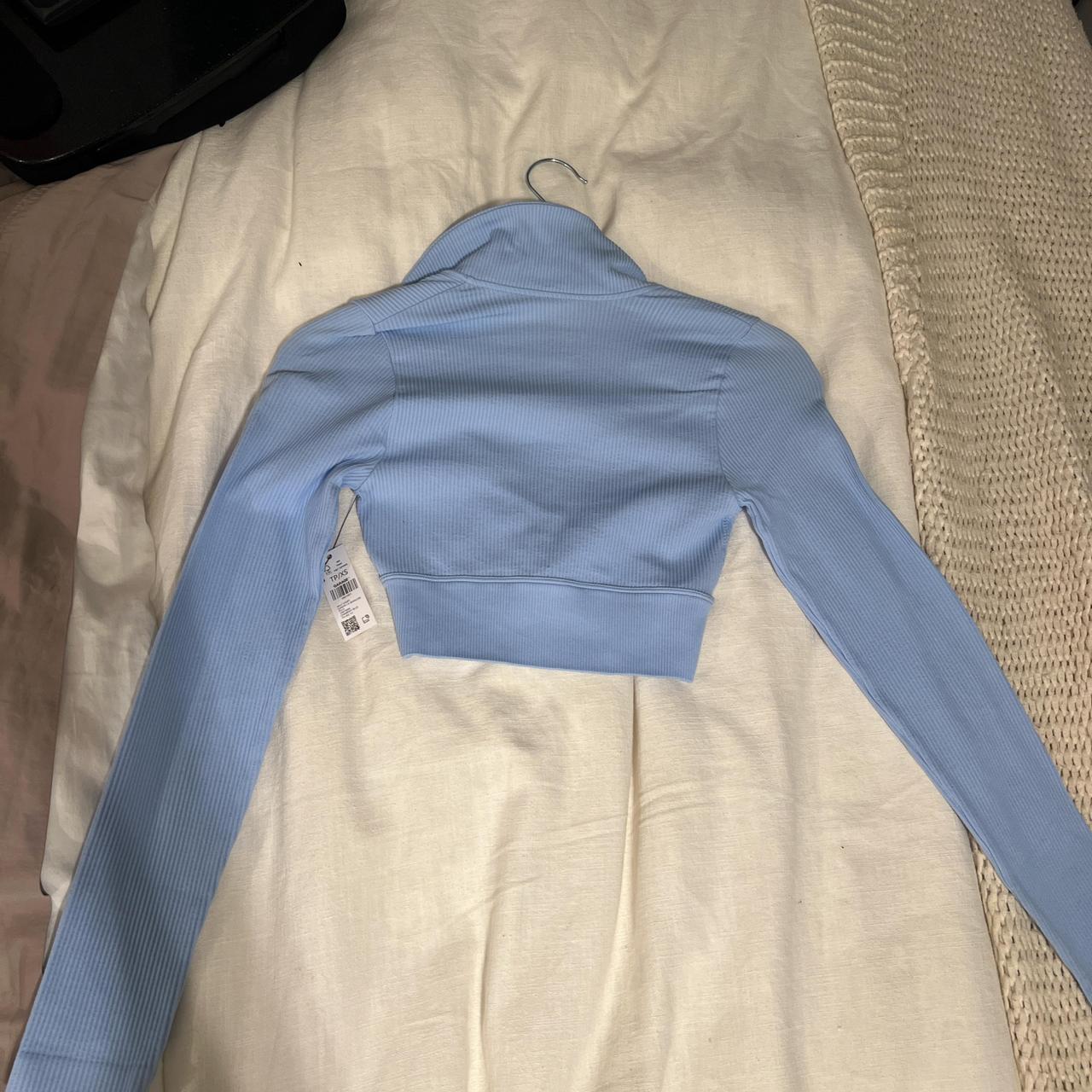 XS discontinued garage sandra polo top plunge... | Depop