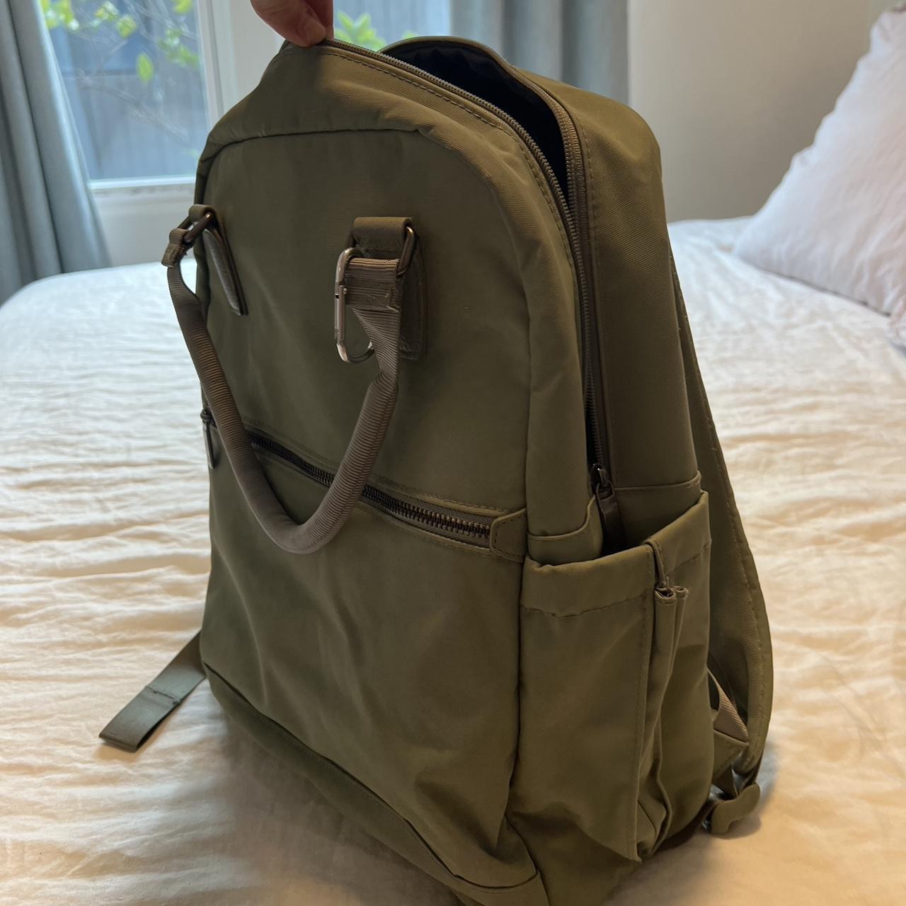 Green commuter backpack with front pocket, water... - Depop