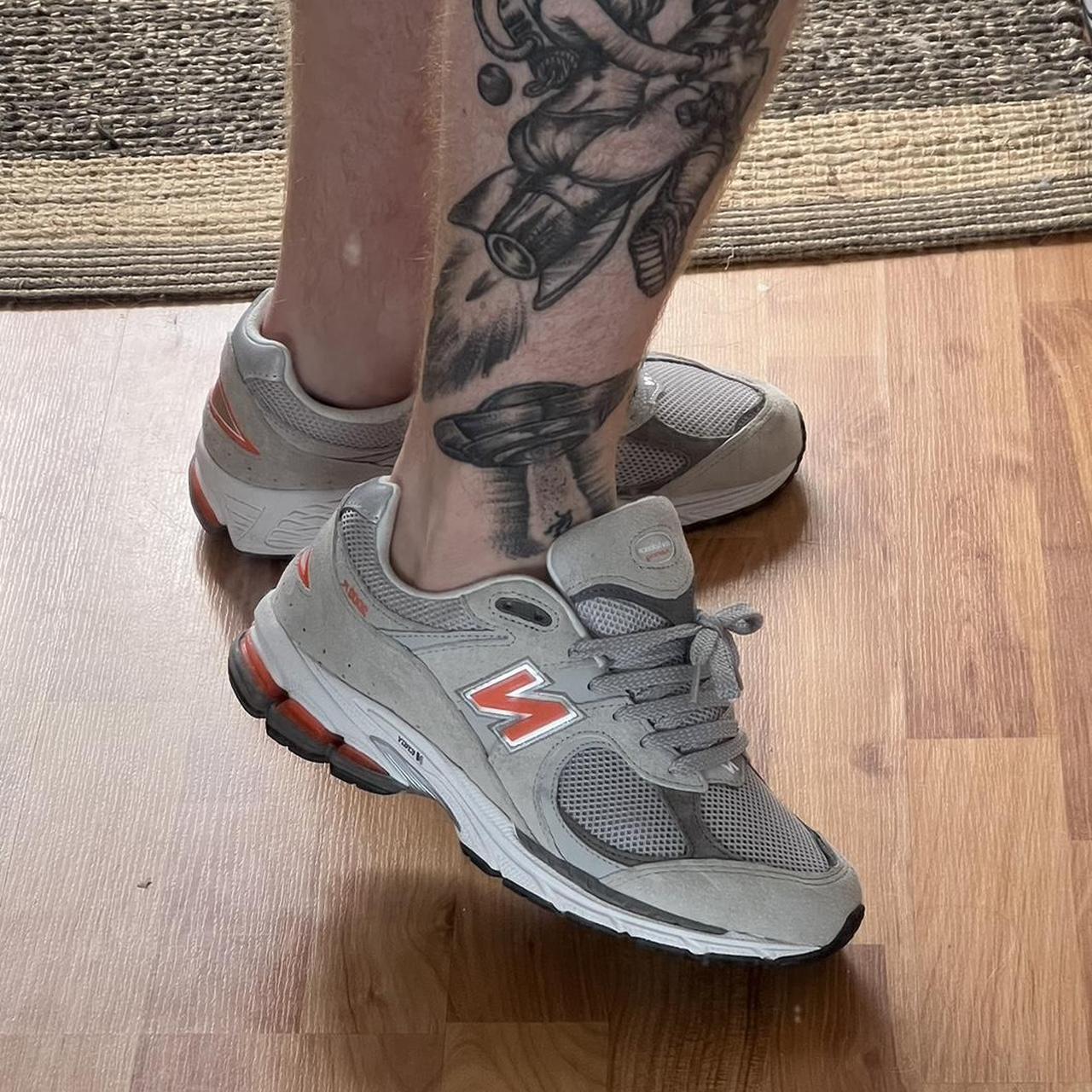 New balance 2002r grey and orange, Very good... - Depop