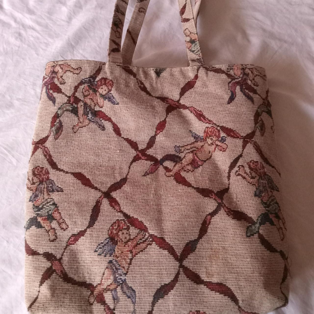 Cute angel tote bag small stain on the back side... - Depop