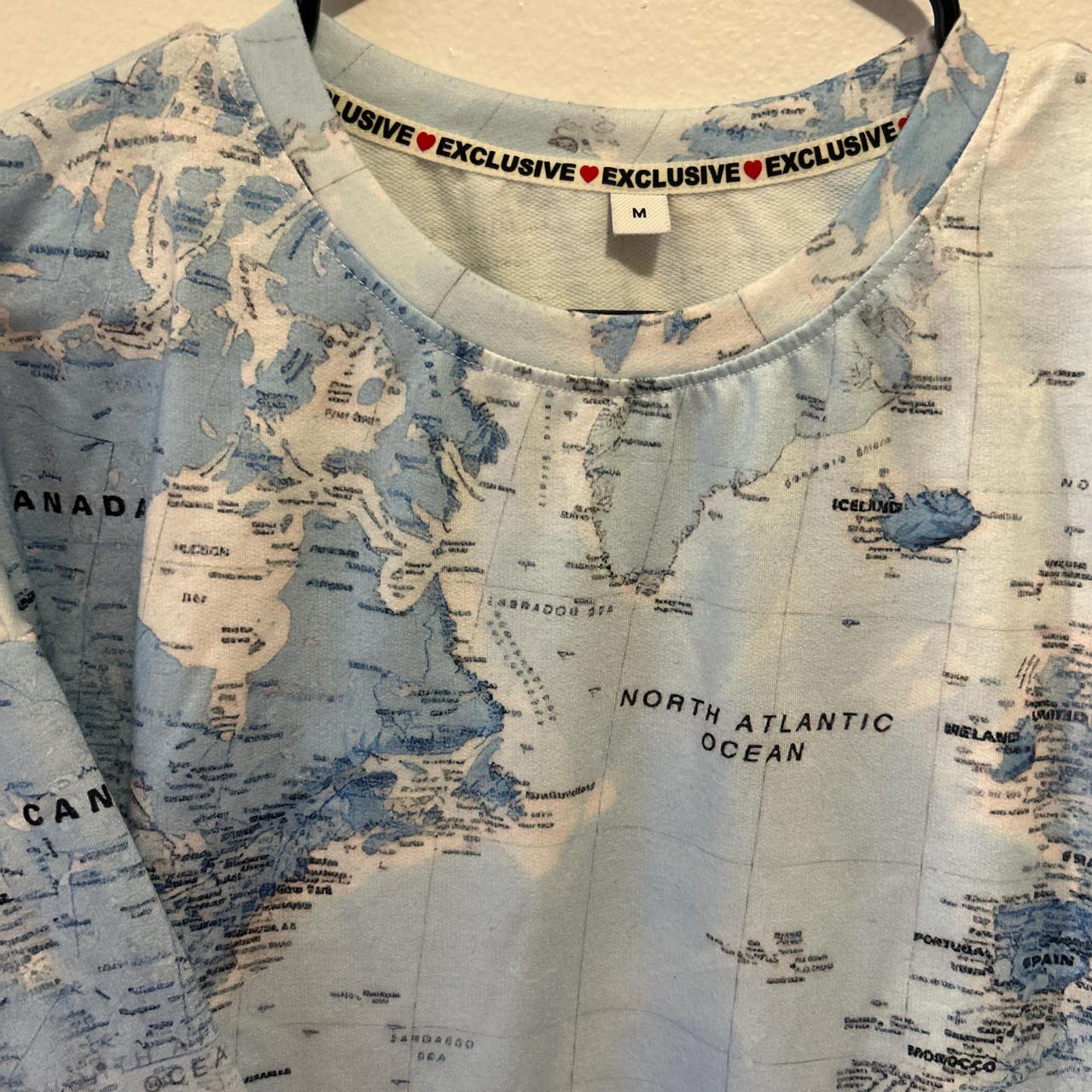 Blue and white World Map long sleeve light... | Depop