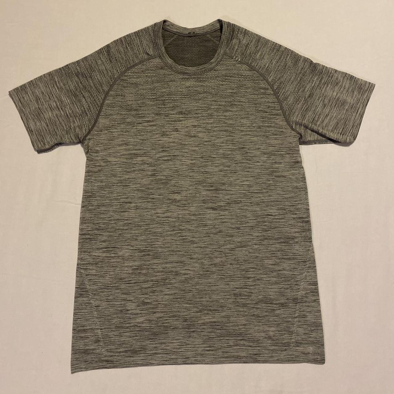 Lulu lemon grey workout shirt. No size tag but fits... - Depop