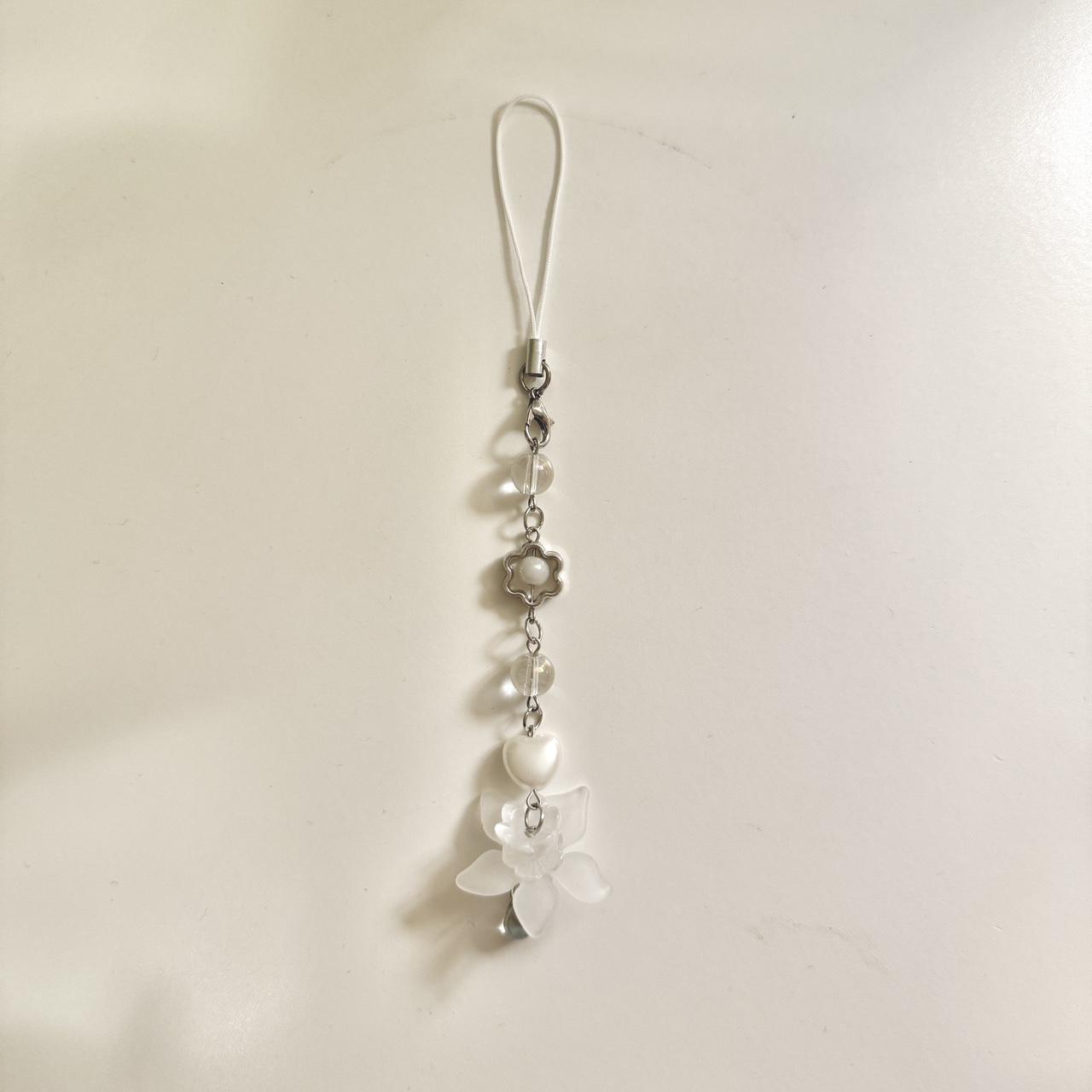 Simple flower bead phone charm / keychain, in white... - Depop