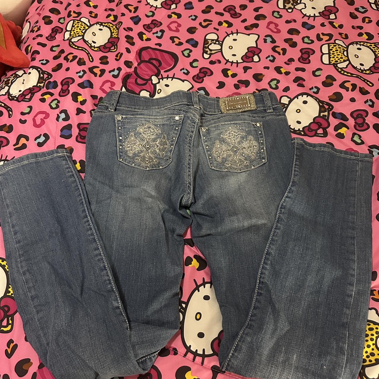 low-rise skinny jeans with rhinestone detailing the... - Depop