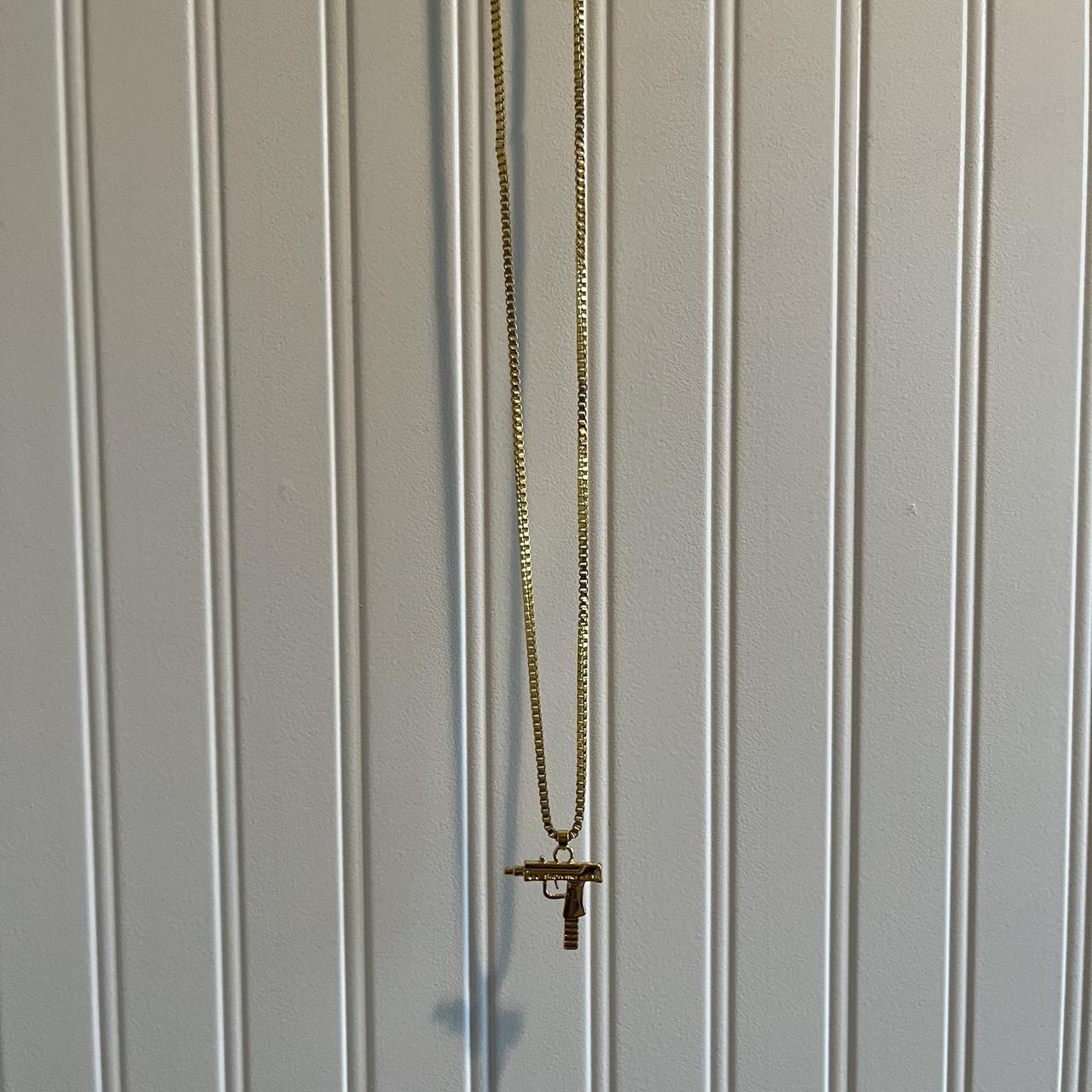 “Supreme” style gold tommy gun chain necklace - Depop