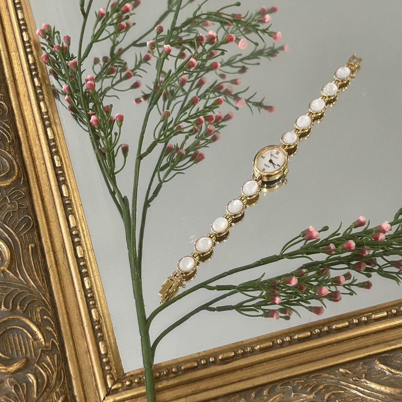 Vintage gold Lucoral watch with mother of Pearl... - Depop