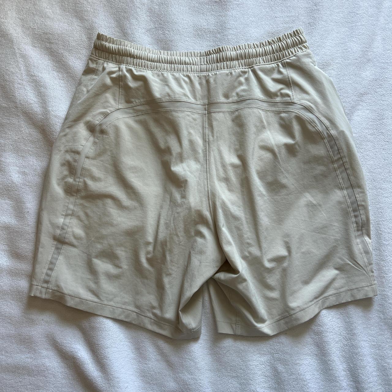 Cream lululemon 7” inseam pace breaker shorts size... - Depop