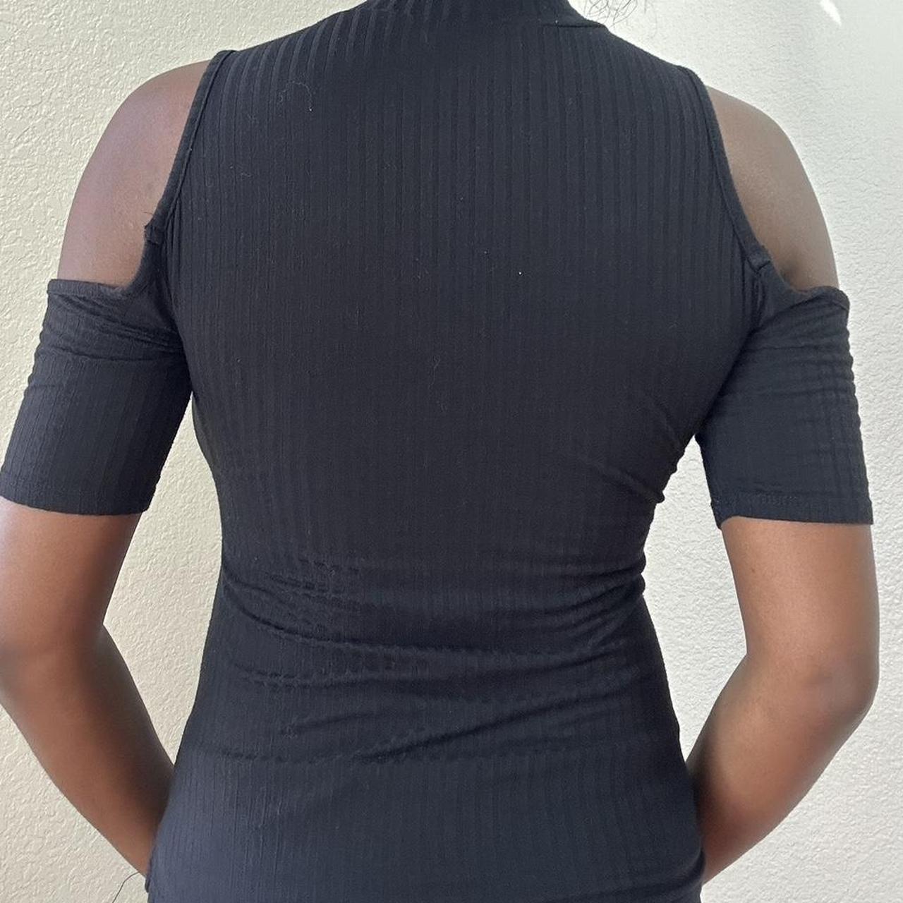 Black cut out top. Ribbed shirt with rounded cut... - Depop