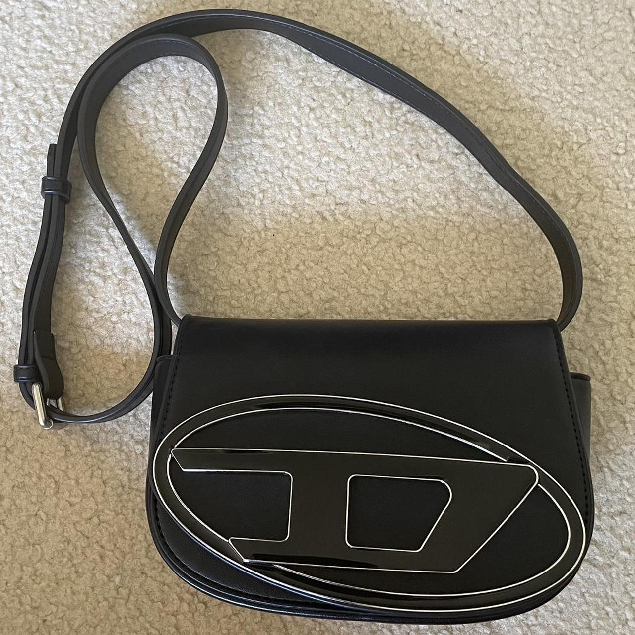 This is a fake diesel bag. This has two straps. One... - Depop