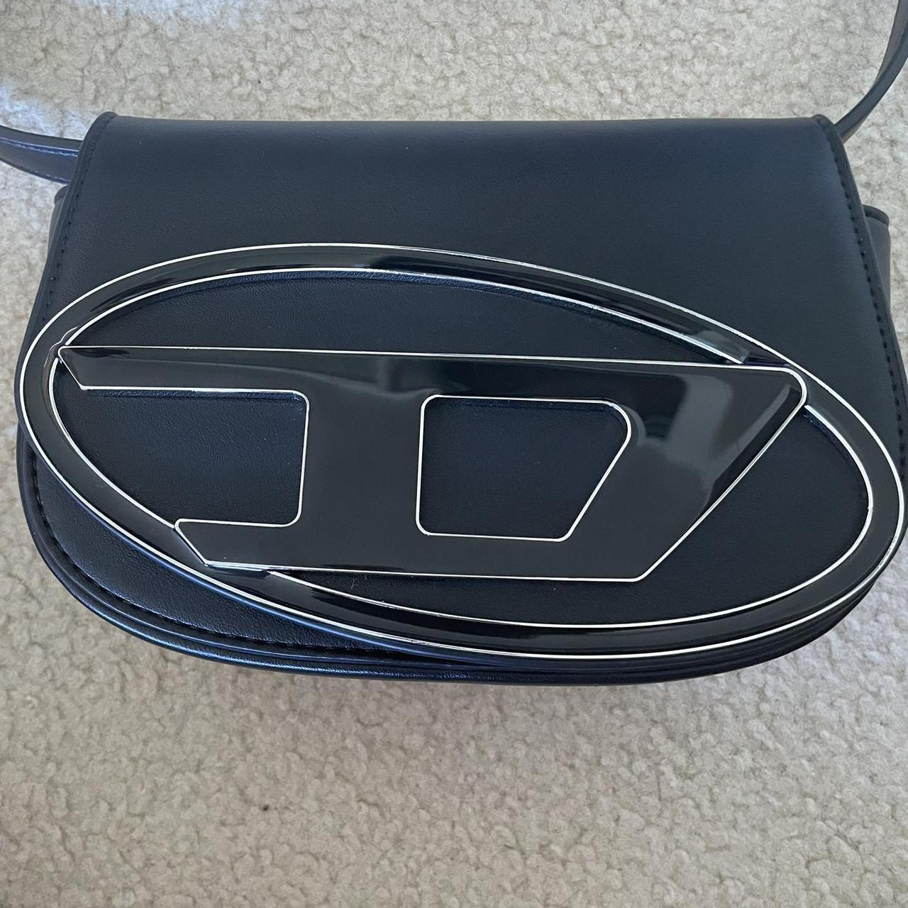 This is a fake diesel bag. This has two straps. One... - Depop