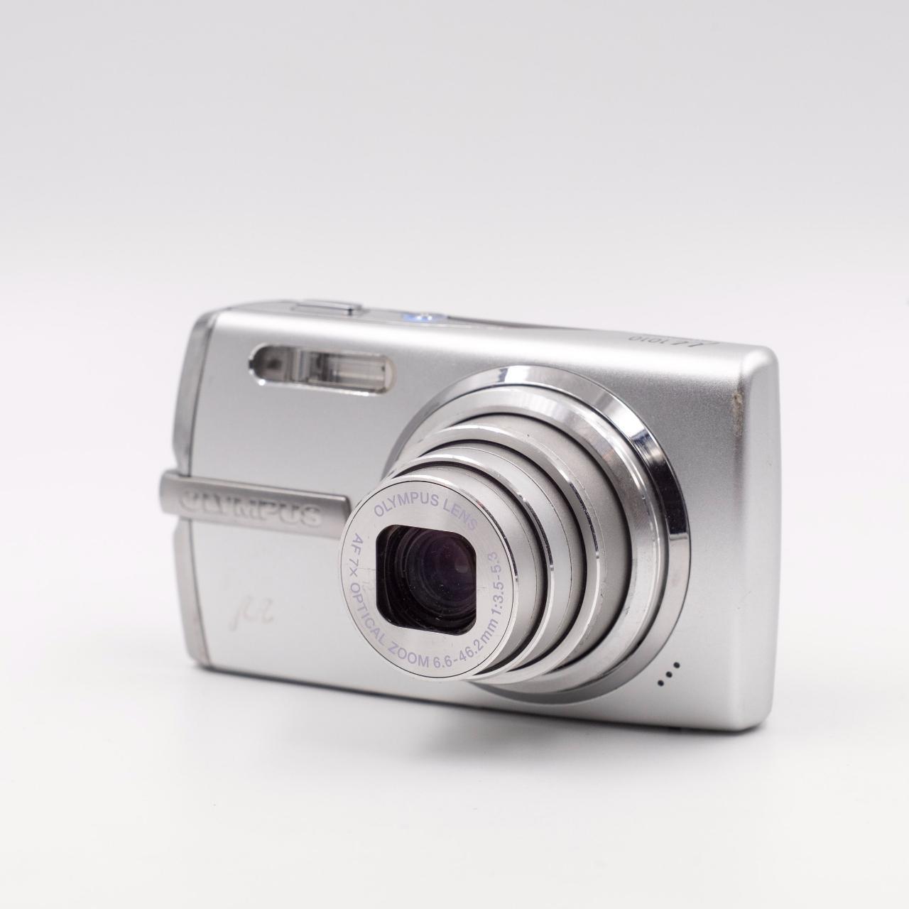 Late 2000s sleek silver ultracompact Olympus 10MP... - Depop