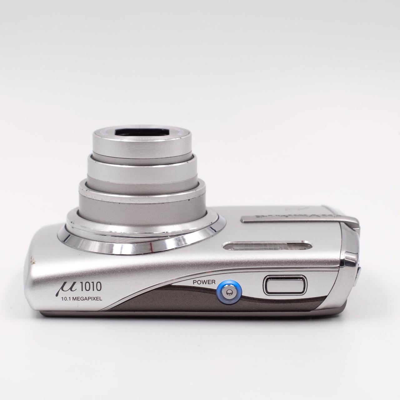 Late 2000s sleek silver ultracompact Olympus 10MP... - Depop