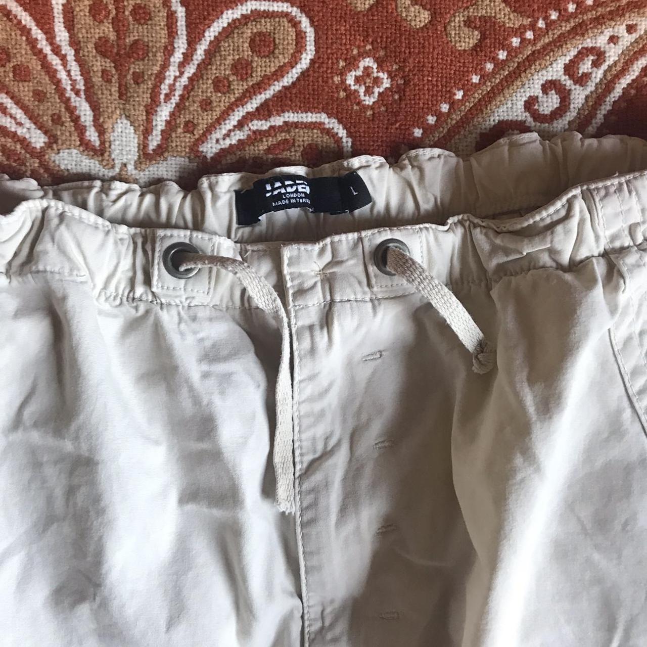 Jaded baggy mens parachute tech pants in cream/... - Depop