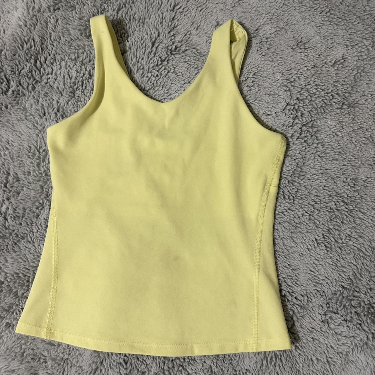 Pale yellow tank that stretches and has built in bra... | Depop