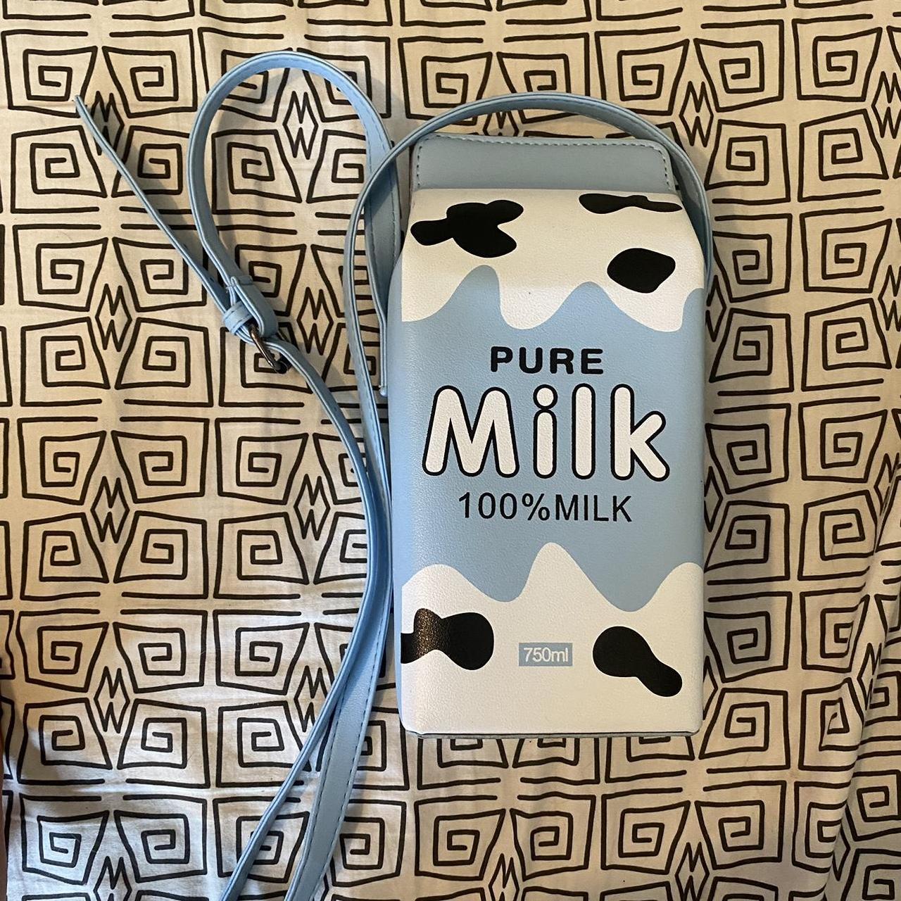 Milk purse used once only. Dented from where it... - Depop