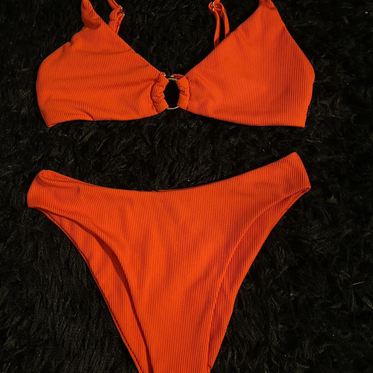 Red women’s bikini with O ring on the top. Pants are... - Depop
